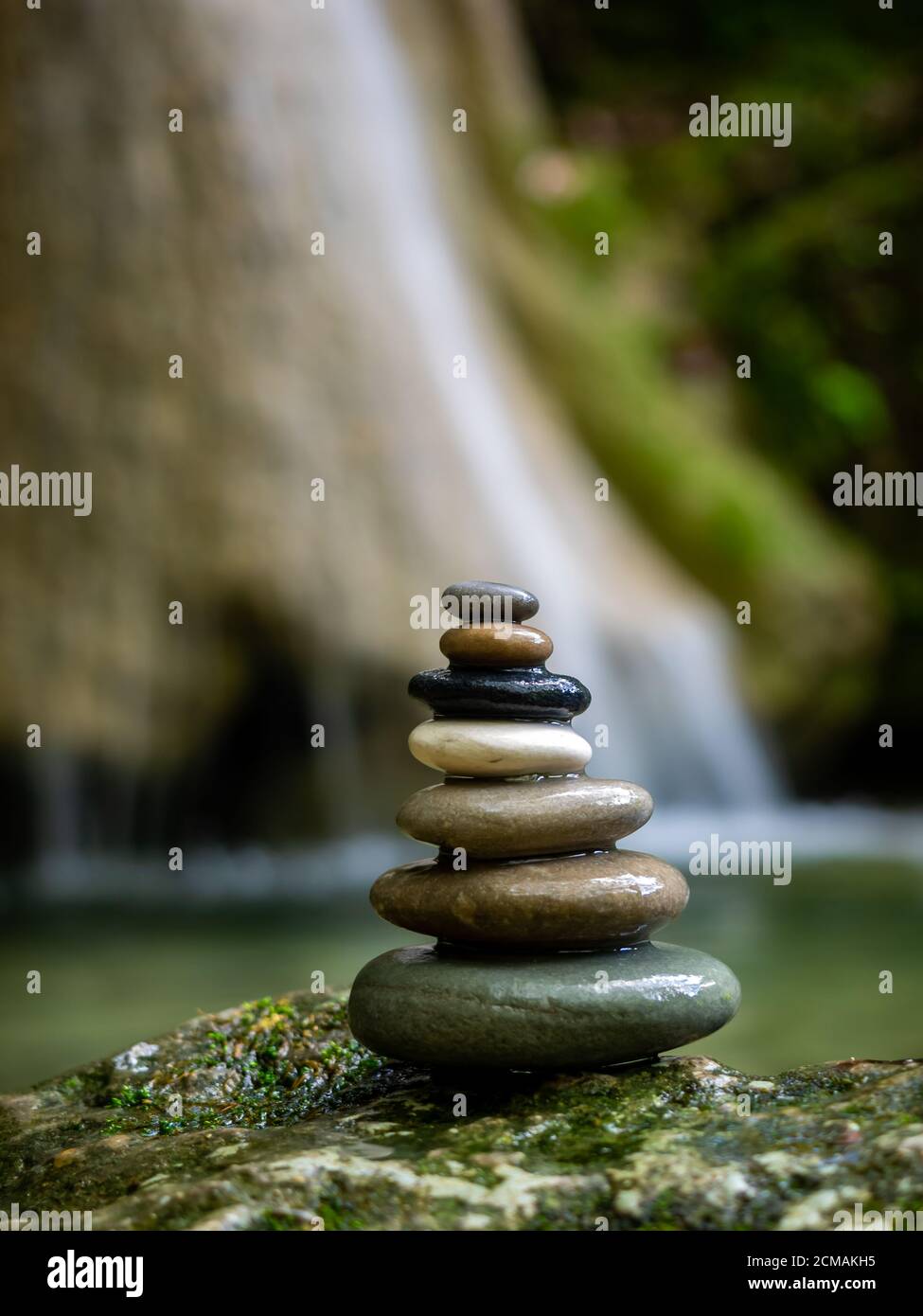 Balanced Zen stones pebbles at the waterfalls Stock Photo - Alamy
