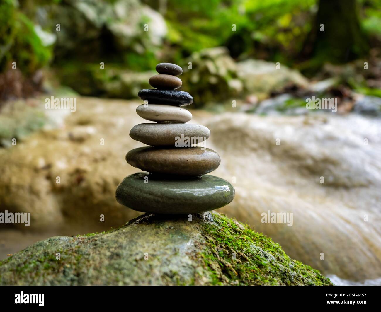 Balanced Zen stones pebbles at the waterfalls Stock Photo - Alamy