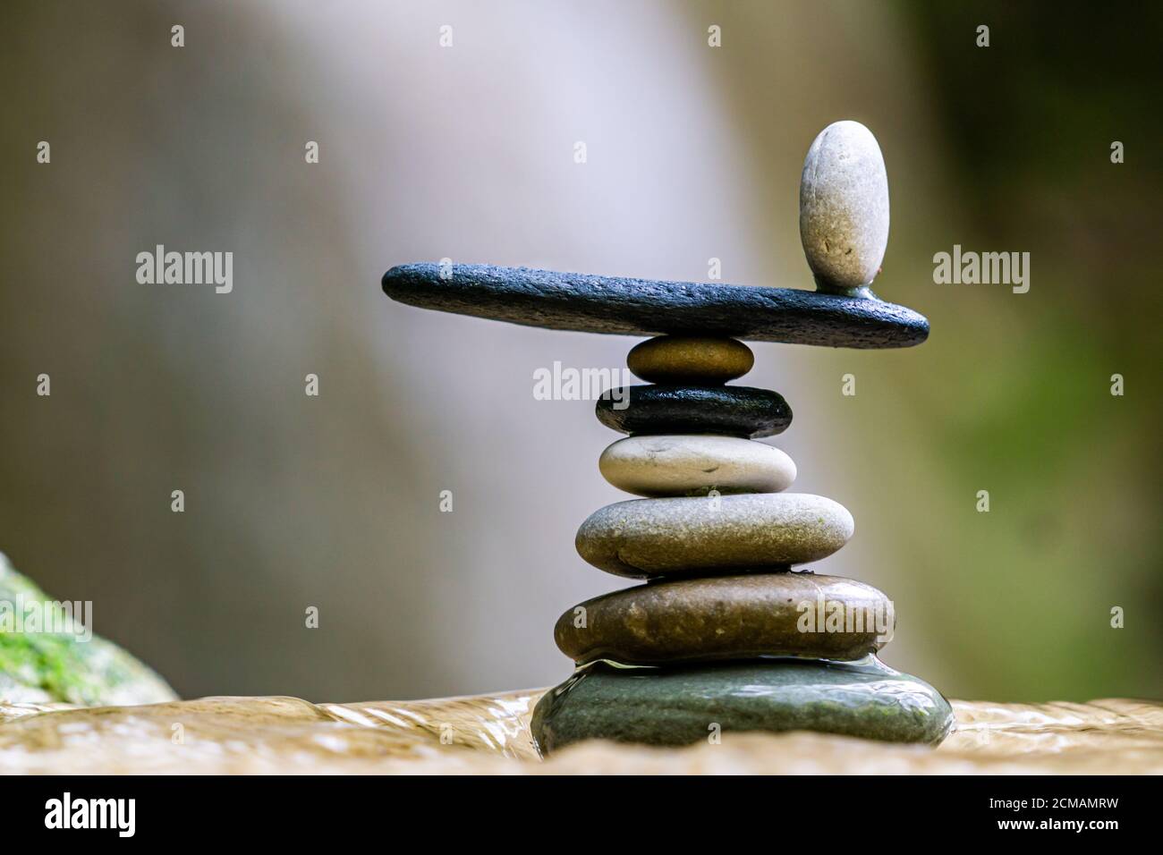 Balanced Zen stones pebbles at the waterfalls Stock Photo - Alamy