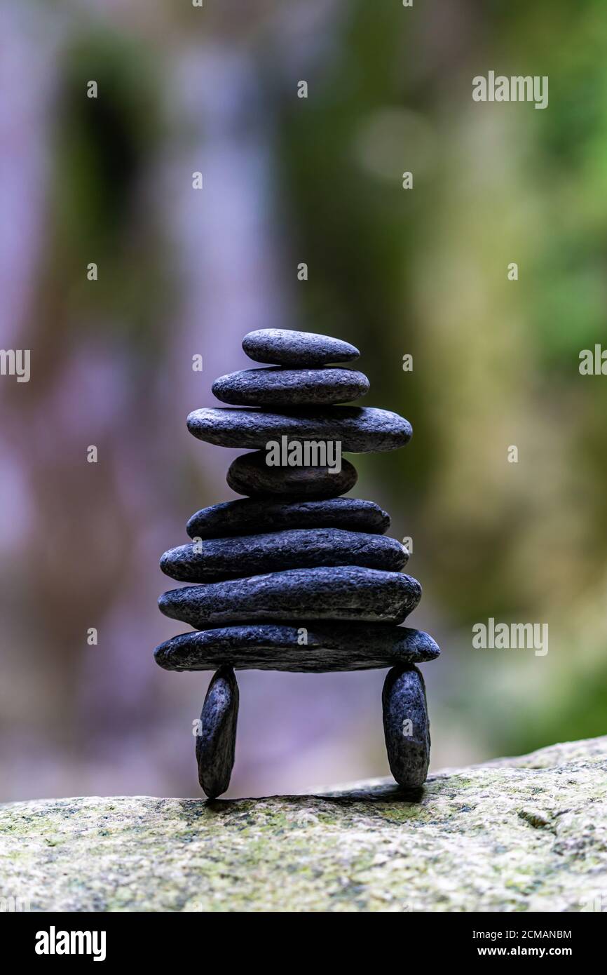 Balanced Zen stones pebbles at the waterfalls Stock Photo - Alamy