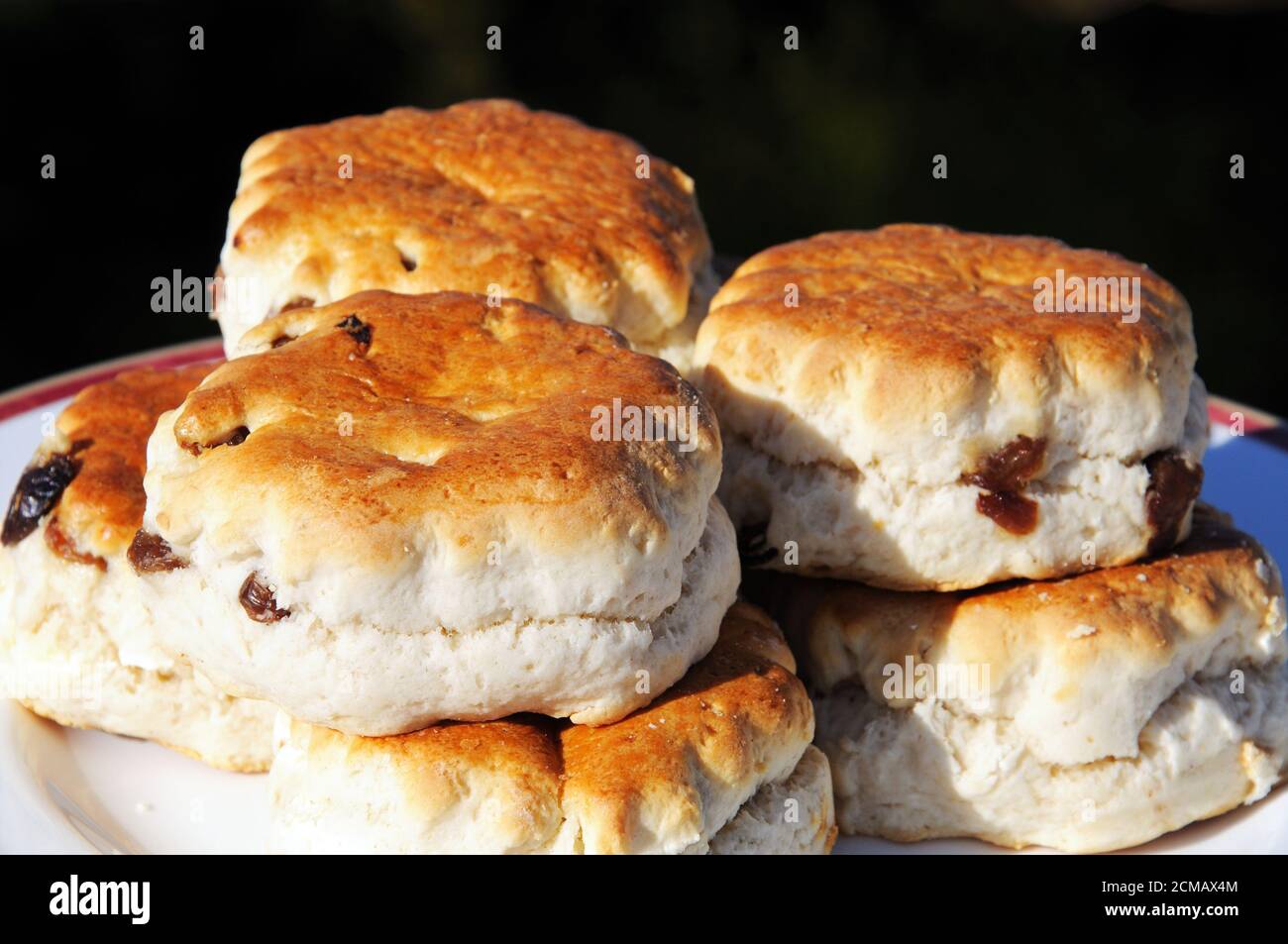 A stack of Sultana scones on a bone china plate Stock Photo - Alamy