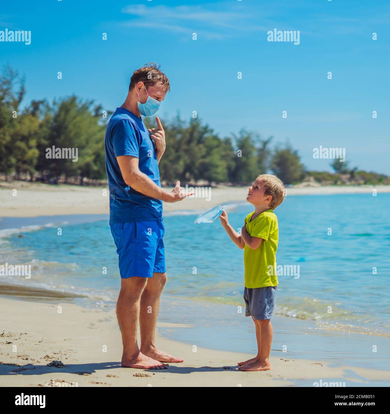 Normal reality COVID pandemic. Father ask boy put on mask protect ...