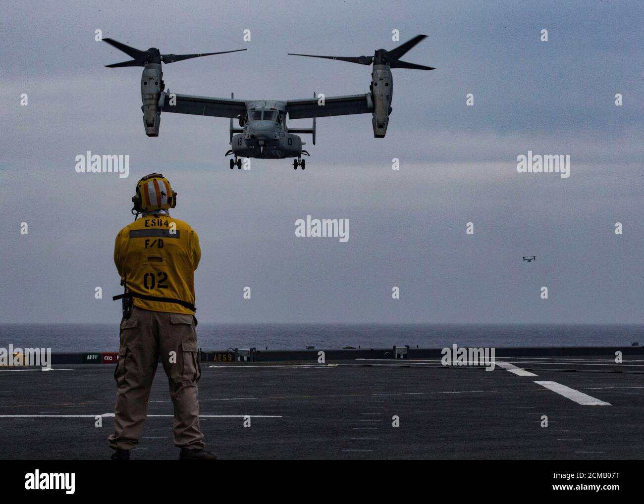 U.S. Marines with VMM-263 and Sailors aboard the Expeditionary Sea Base ...