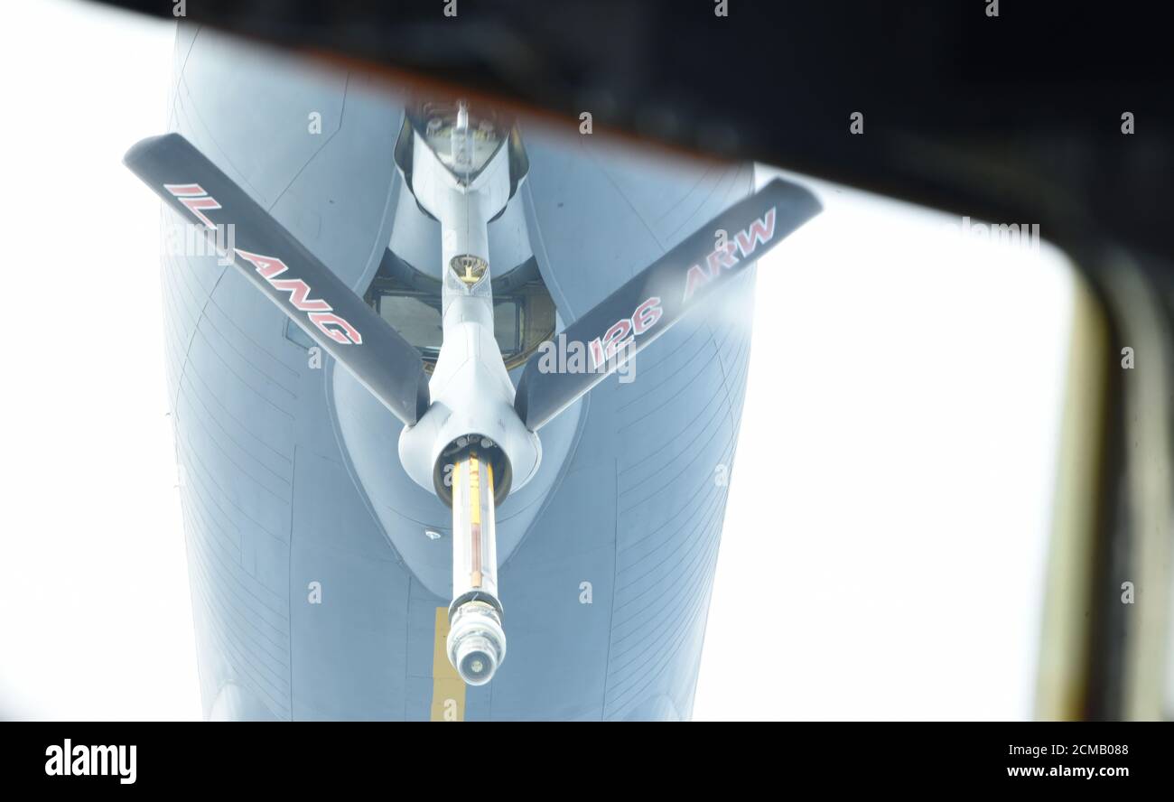 A KC-135 Stratotanker, 126th Air Refueling Wing, extends their boom to ...