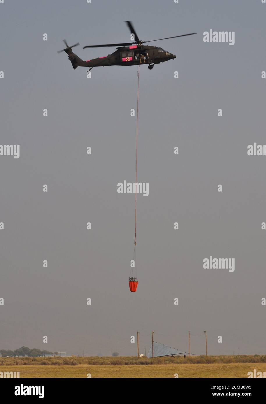 An Oregon Army Guard HH-60M Black Hawk helicopter hovers preparing to ...