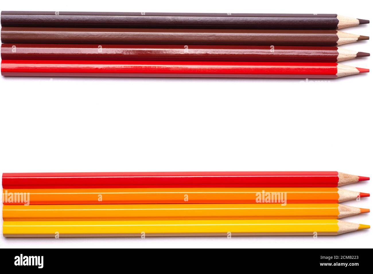 multi-colored wooden pencils in red shades on a white isolated ...