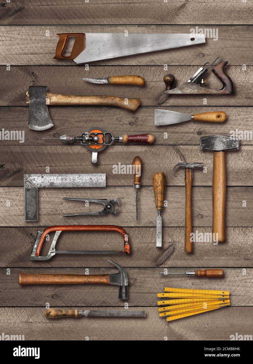 Old carpenter DIY hand tools on weathered wooden plank background, soft ...