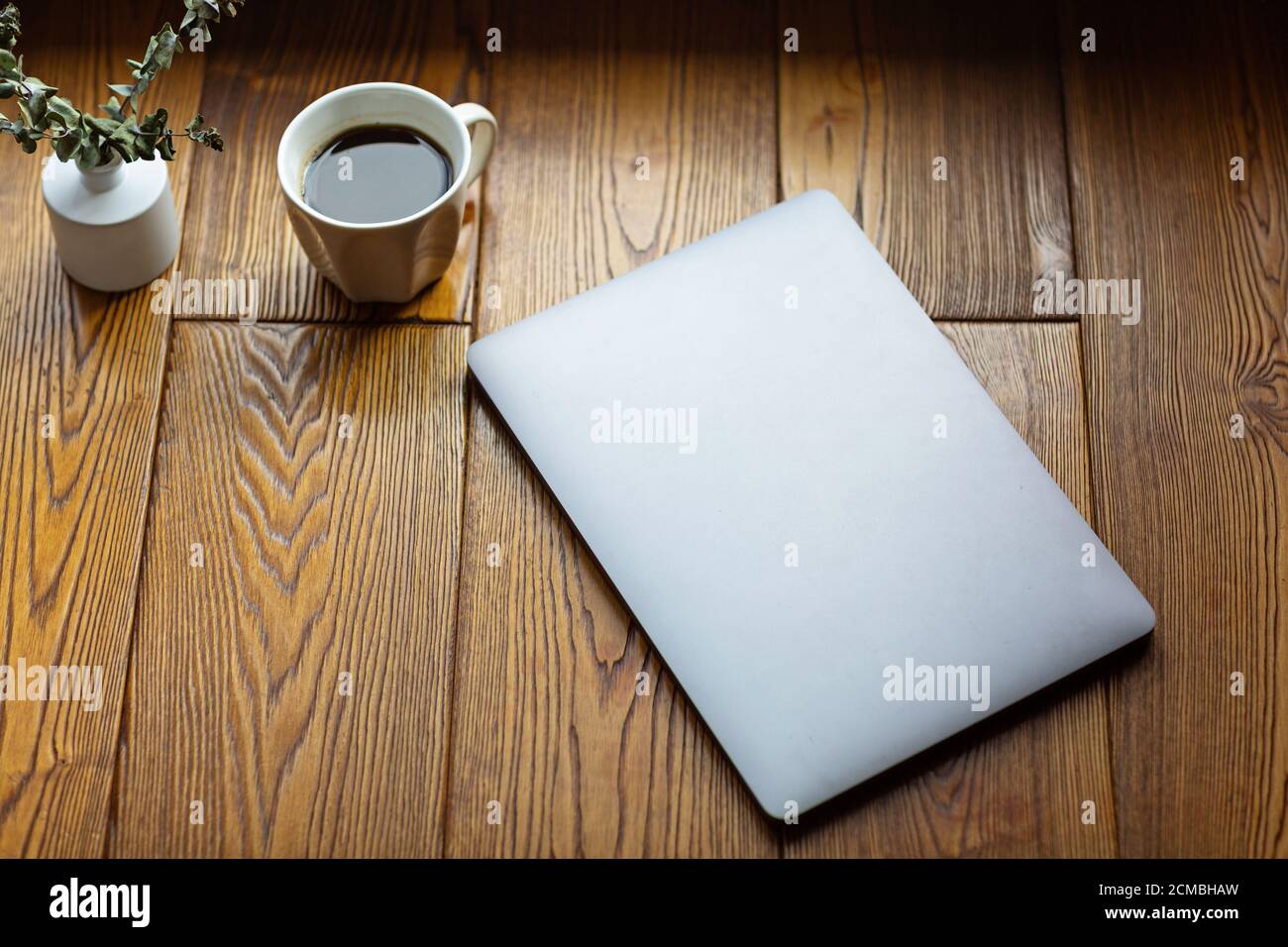 Top view of laptop computer, cup of coffee on desk. Flat lay, overhead ...