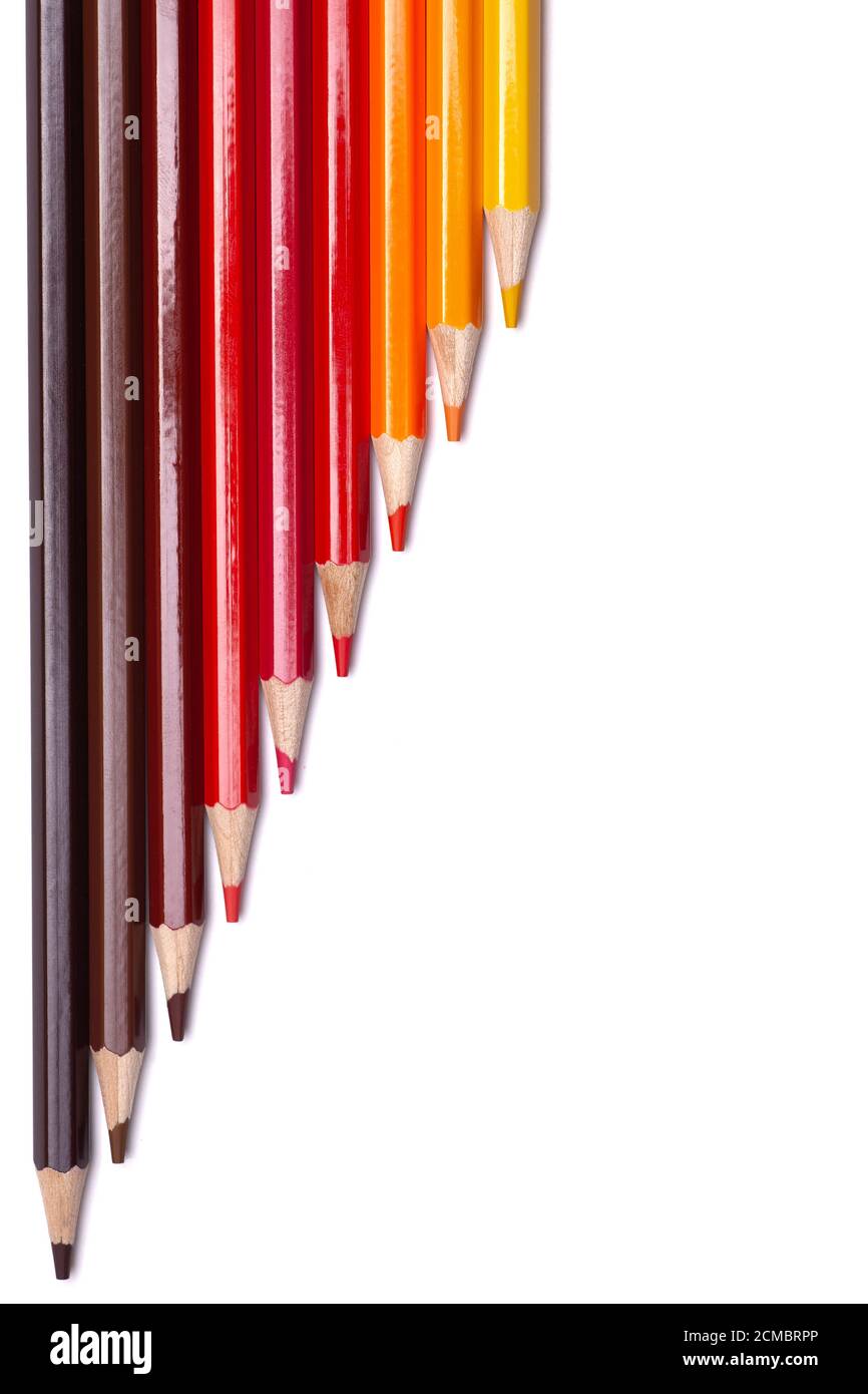 multi-colored wooden pencils in red shades on a white isolated ...