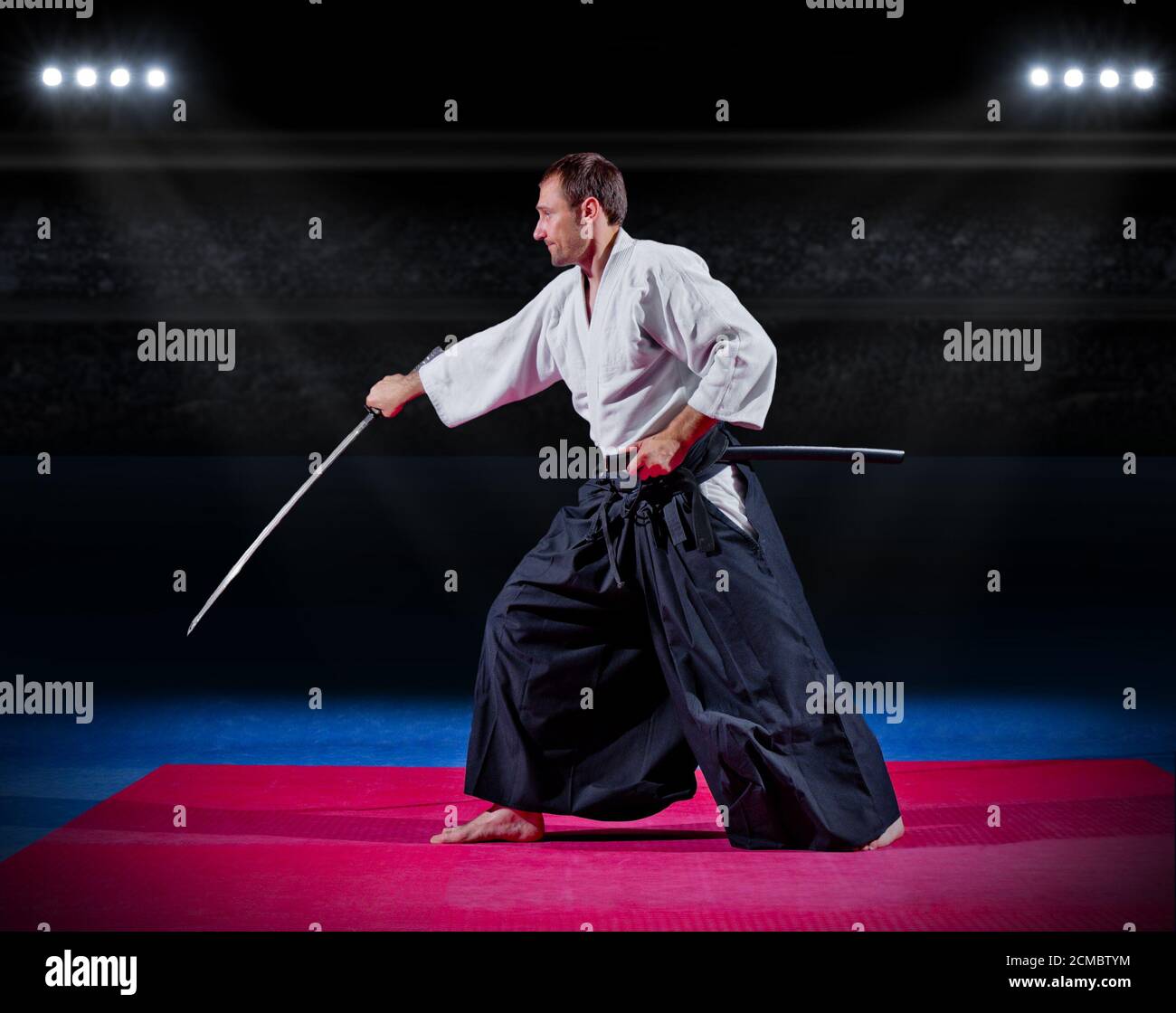 Martial arts fighter with sword at sports hall Stock Photo - Alamy