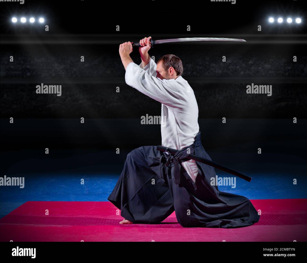 Aikido fighter with sword at sports hall Stock Photo - Alamy
