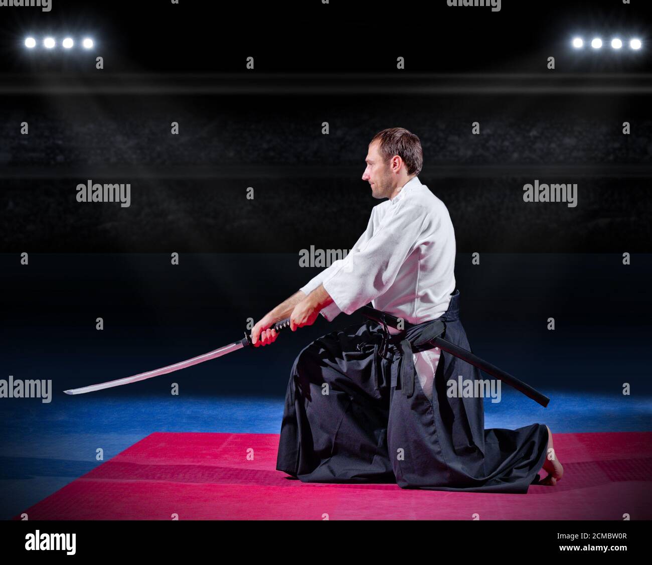 Aikido fighter with sword at sports hall Stock Photo - Alamy