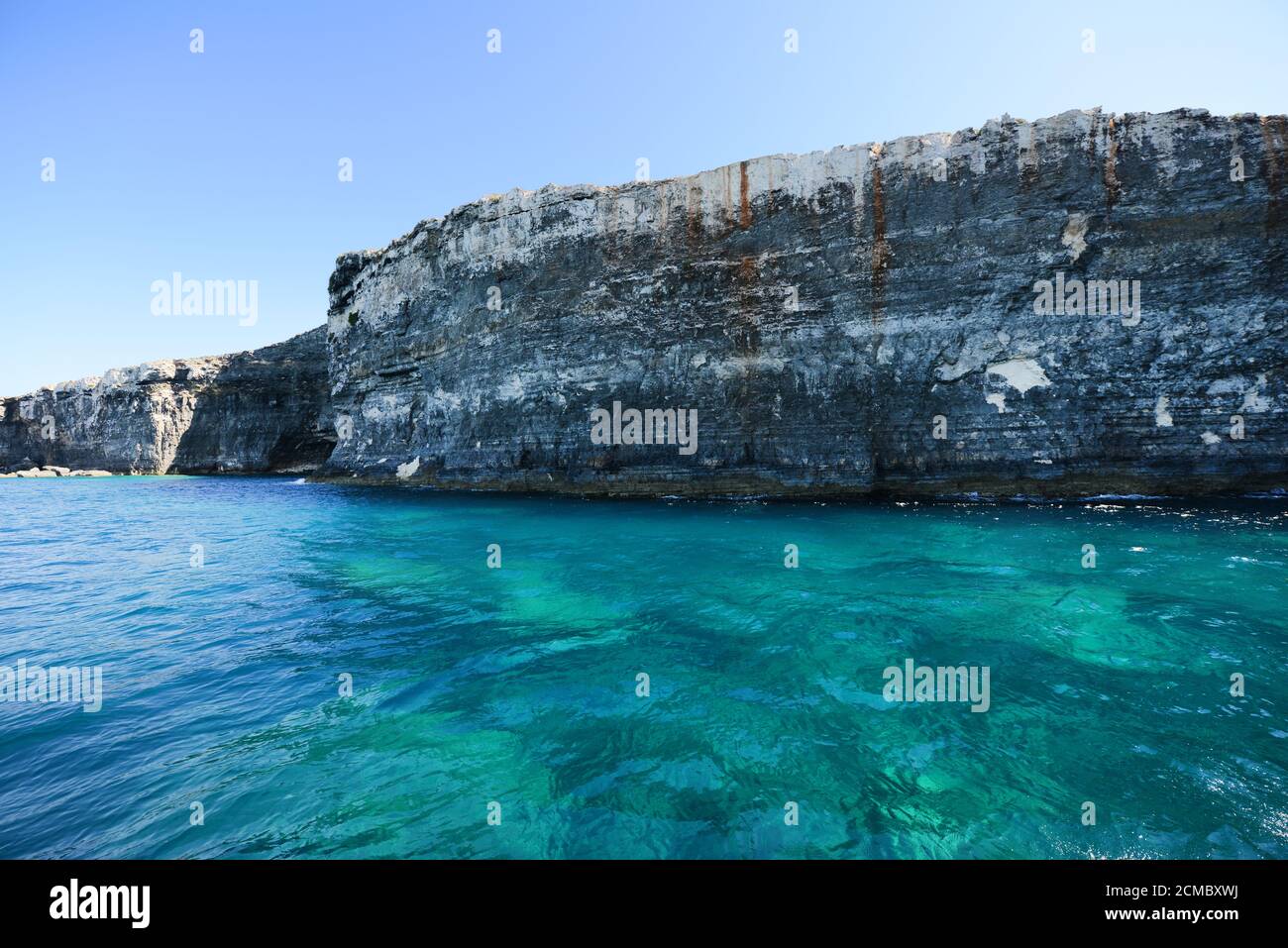 The rocky coastline around Santa Maria Caves in Comino, Malta Stock ...