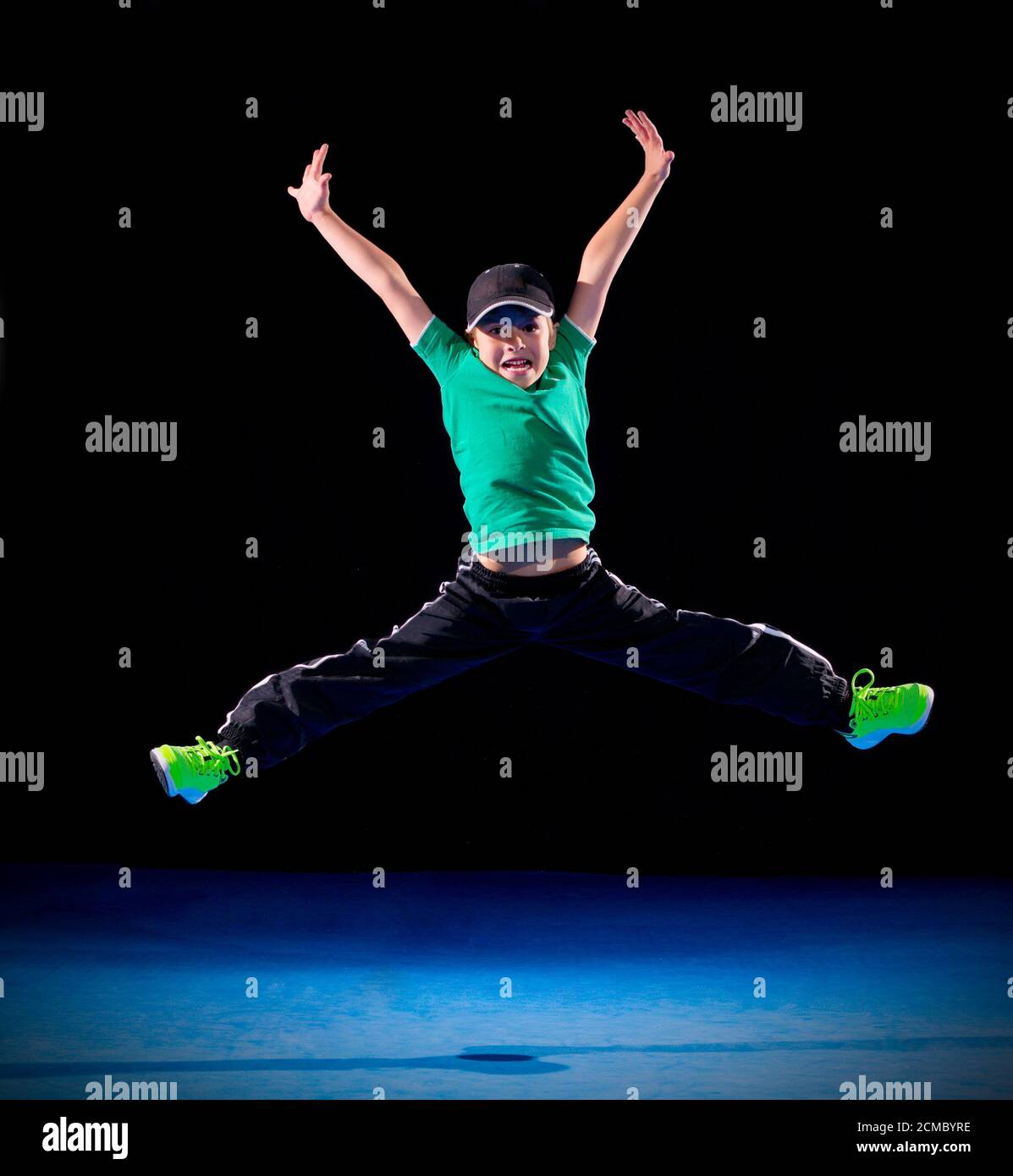 Little boy breakdancer on black Stock Photo - Alamy