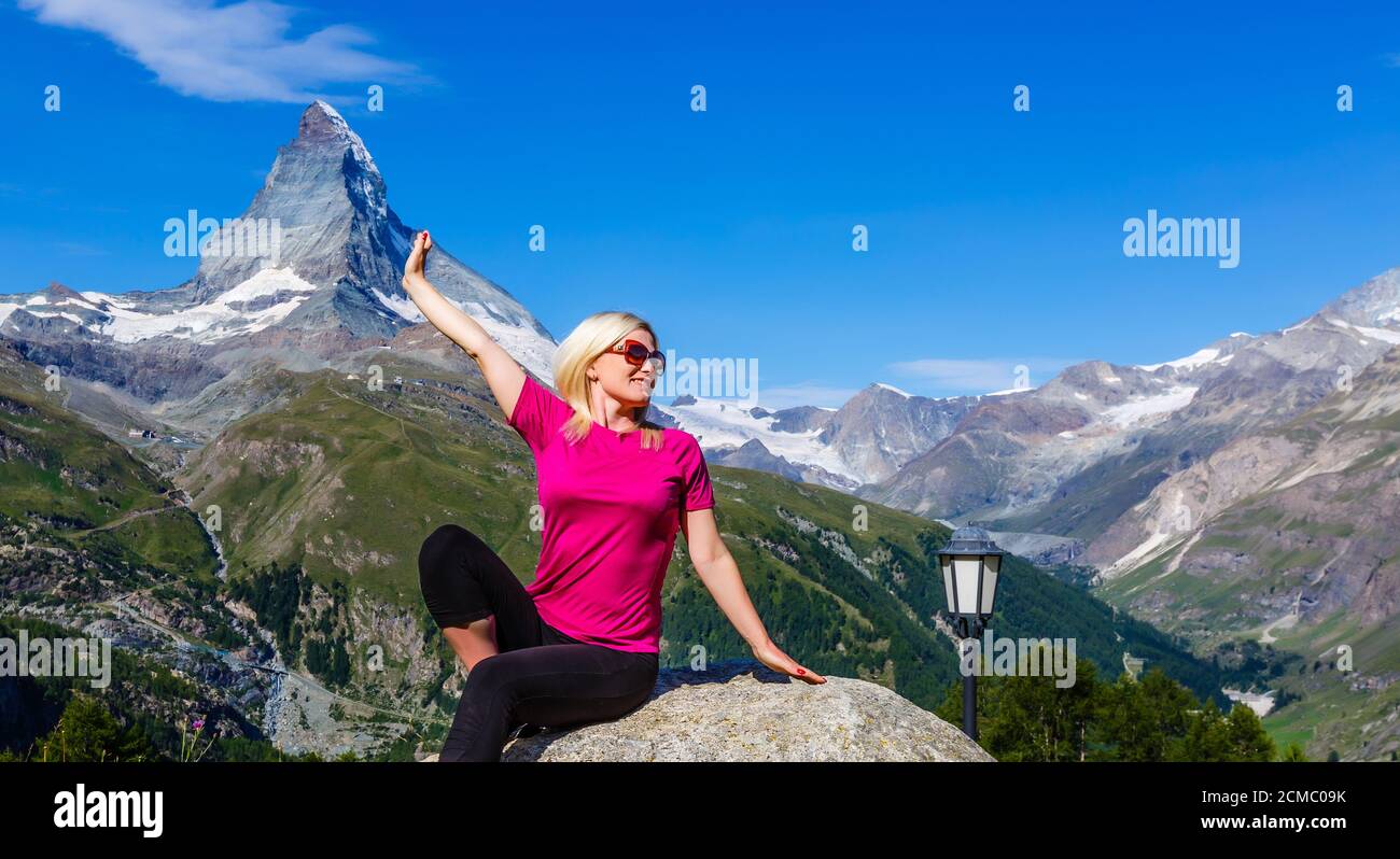 Woman hikers in the Alps, Matterhorn peak in Switzerland Stock Photo ...