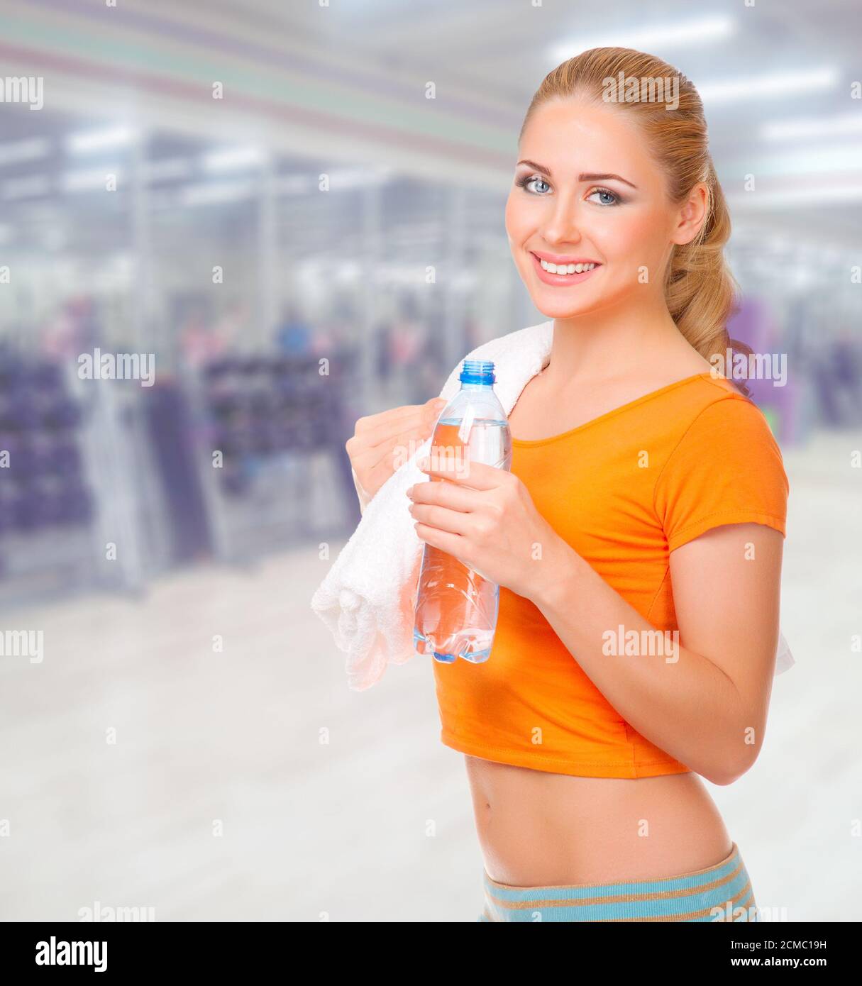 Young woman holding scale hi-res stock photography and images - Alamy