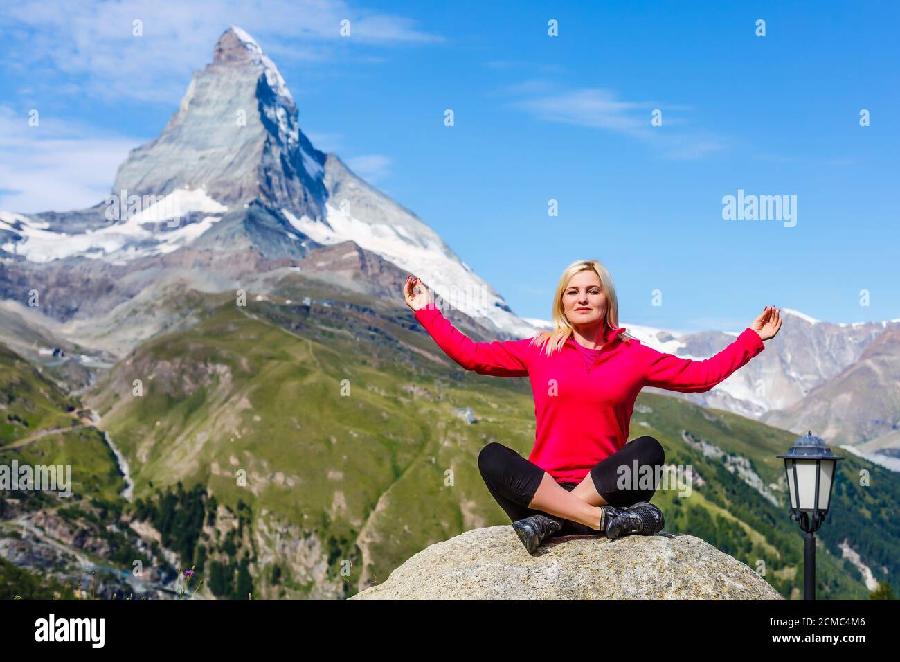 Woman hikers in the Alps, Matterhorn peak in Switzerland Stock Photo ...