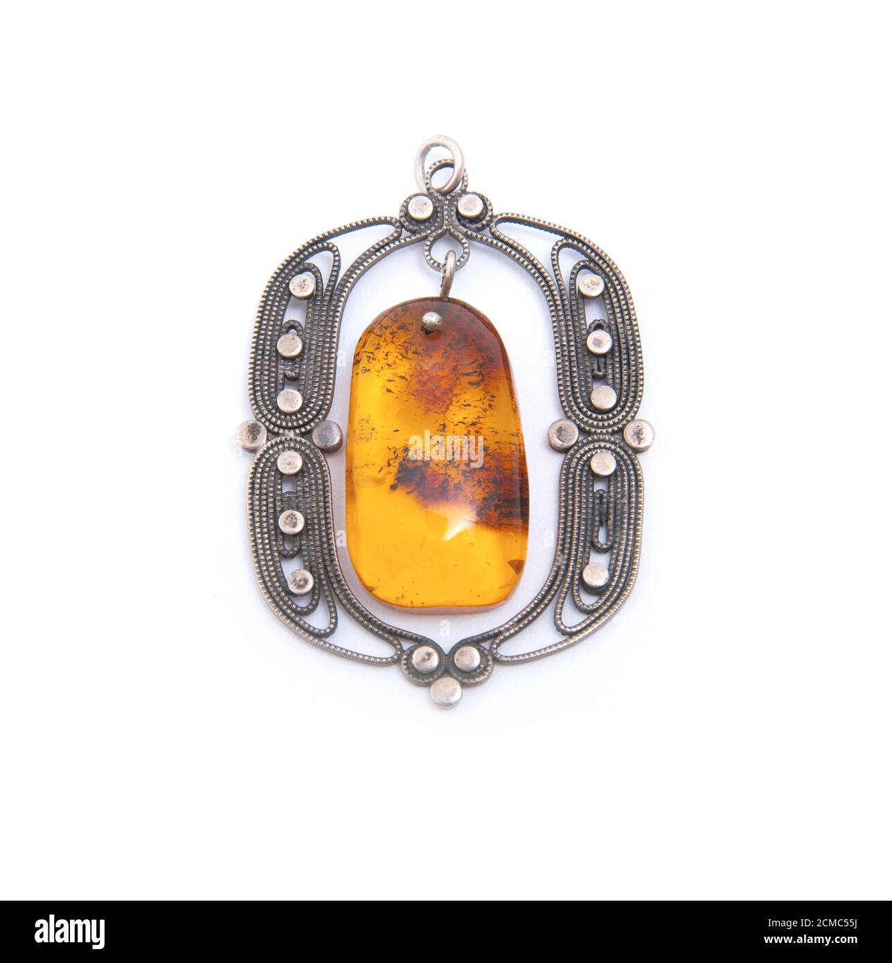 Yellow amber in a silver frame Stock Photo - Alamy