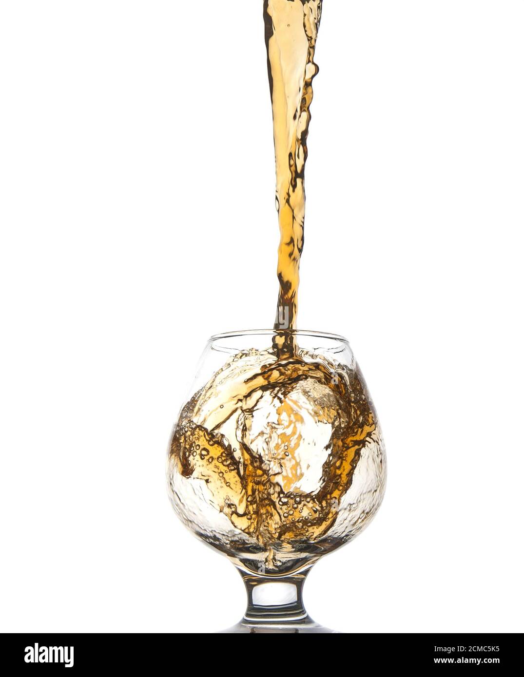 Whiskey being poured into a glass Stock Photo - Alamy