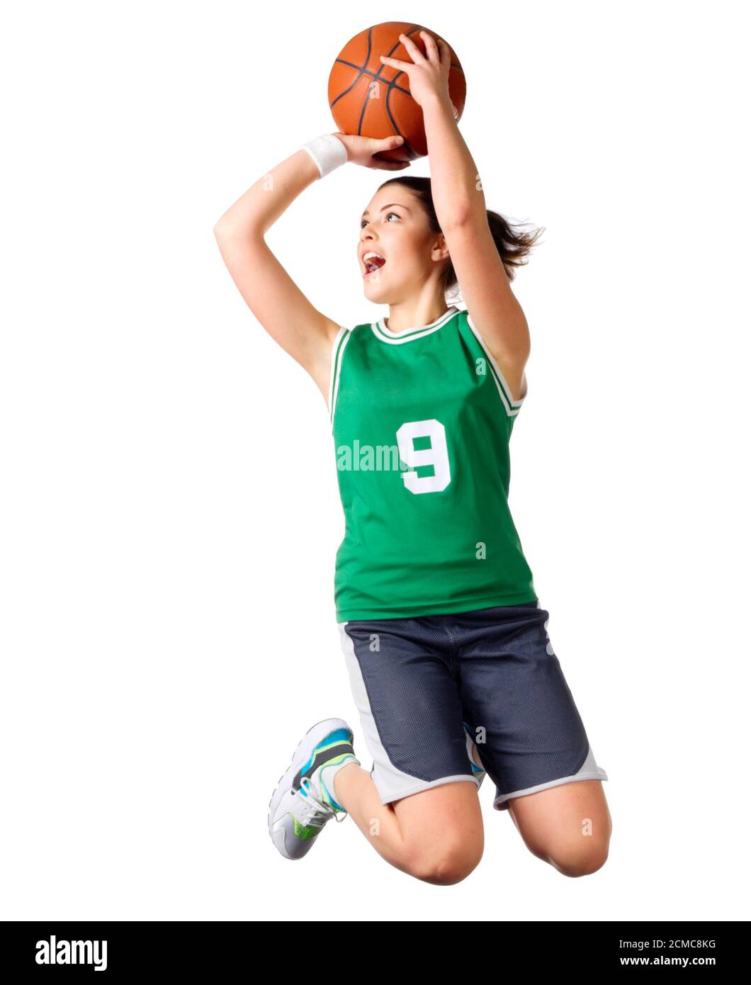 Young girl basketball player isolated Stock Photo - Alamy