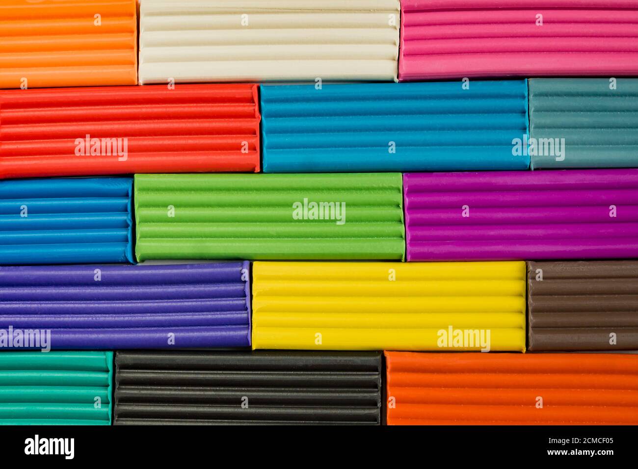 Rainbow colors of modeling clay. Multicolored plasticine bars ...