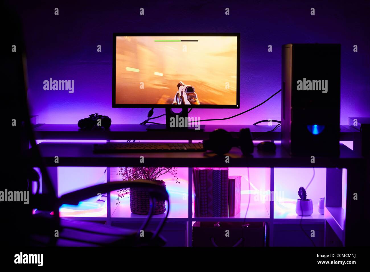 Image of computer monitor with game on it on the table with bright ...