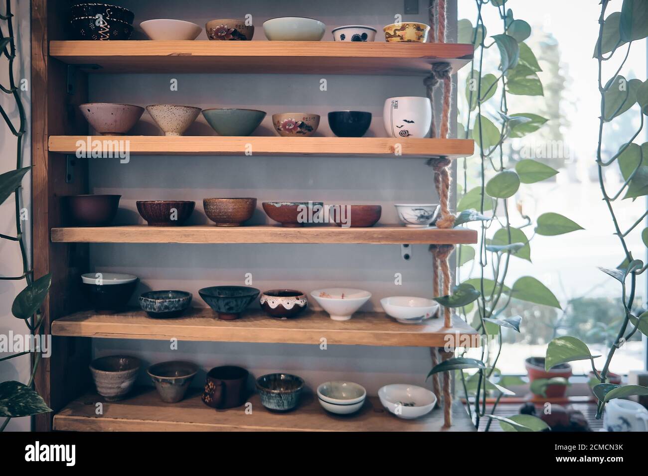 Chinese traditional teaware on the shelves in the tea house Stock Photo ...