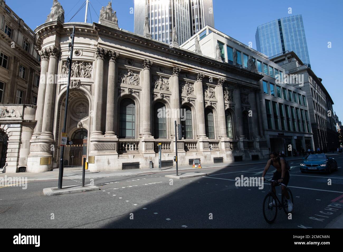 A cyclist riding through a yellow box junction in London Stock Photo ...