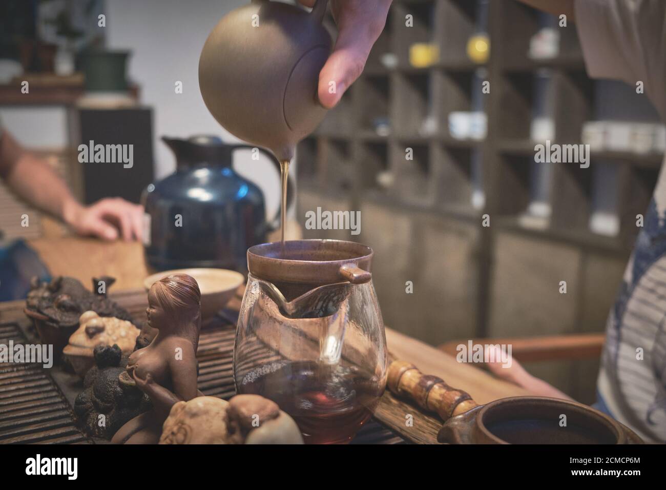 Tea pouring and teaware on tea board. Traditional chinese tea ceremony ...