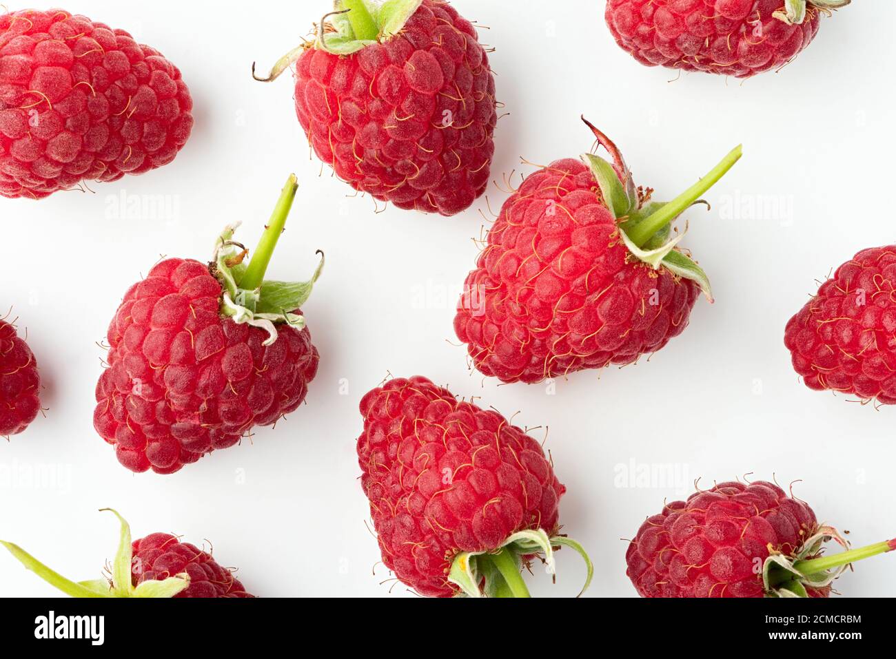 Ripe raspberry fruits with green stems isolated on white background ...