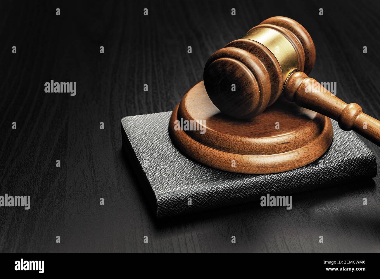 Wooden mallet on black wooden table close up Stock Photo - Alamy