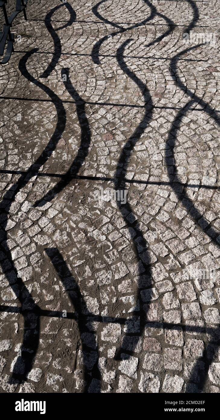 Abstract wavy shadow pattern on paving Stock Photo - Alamy