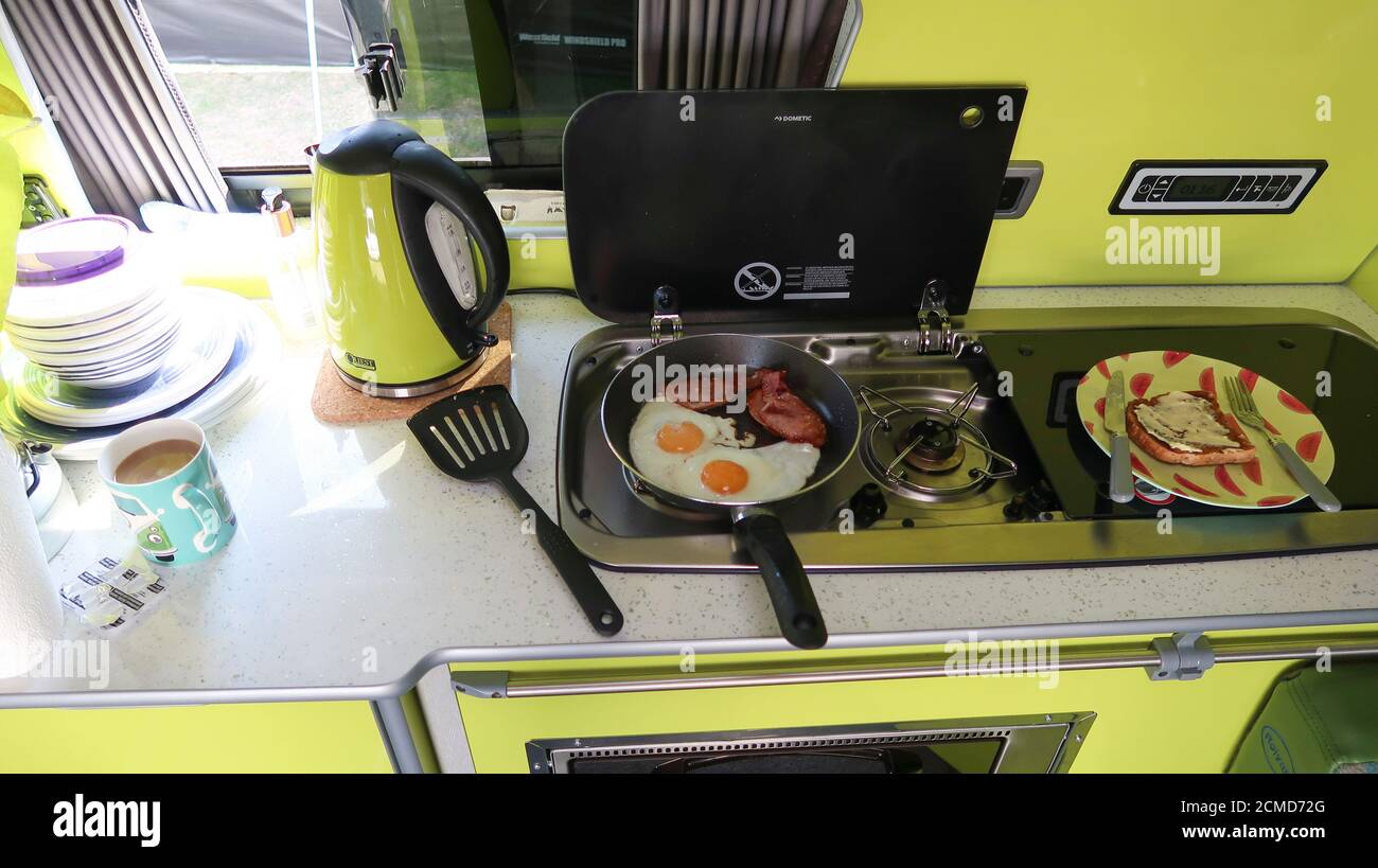 Cooking breakfast in campervan Stock Photo - Alamy