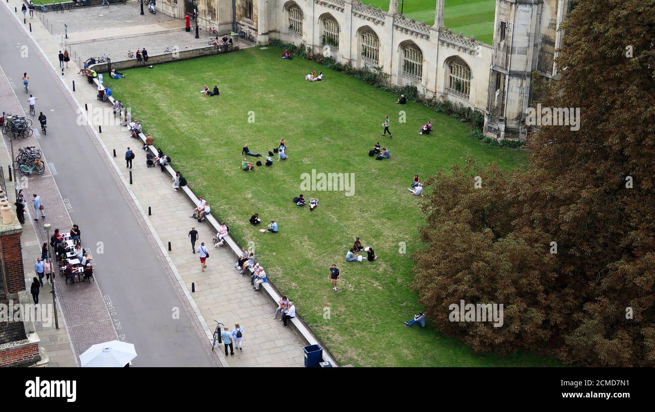 Aerial view of people sitting out on lawns of Kings College Cambridge ...