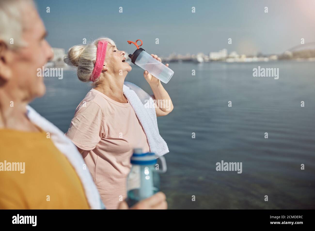 Woman replenishing lost electrolytes after the workout Stock Photo - Alamy