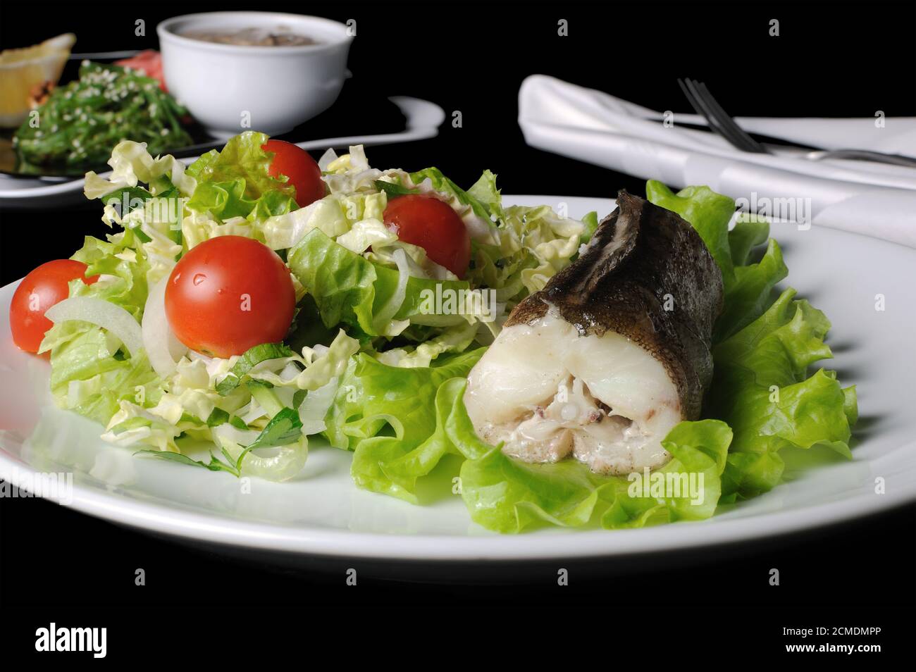 Baked fish (King clip) with vegetables Stock Photo - Alamy