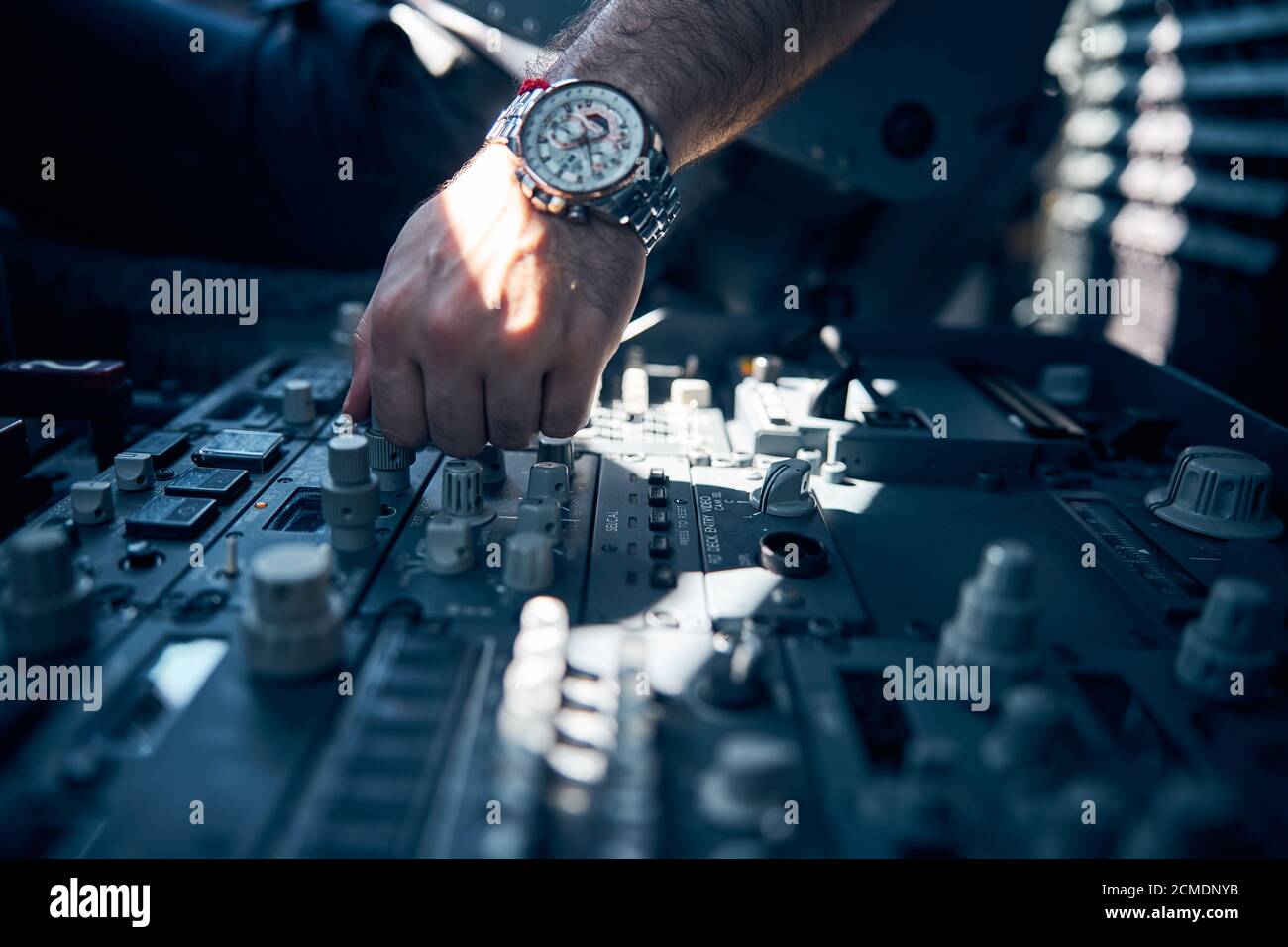 The center console and instrument panel with man arm Stock Photo - Alamy