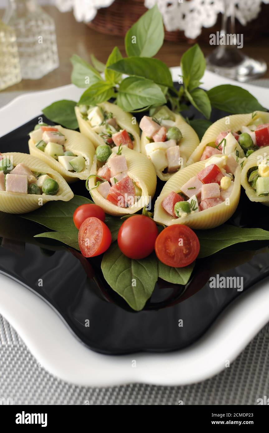 Sea shells pasta stuffed with vegetables and ham Stock Photo - Alamy