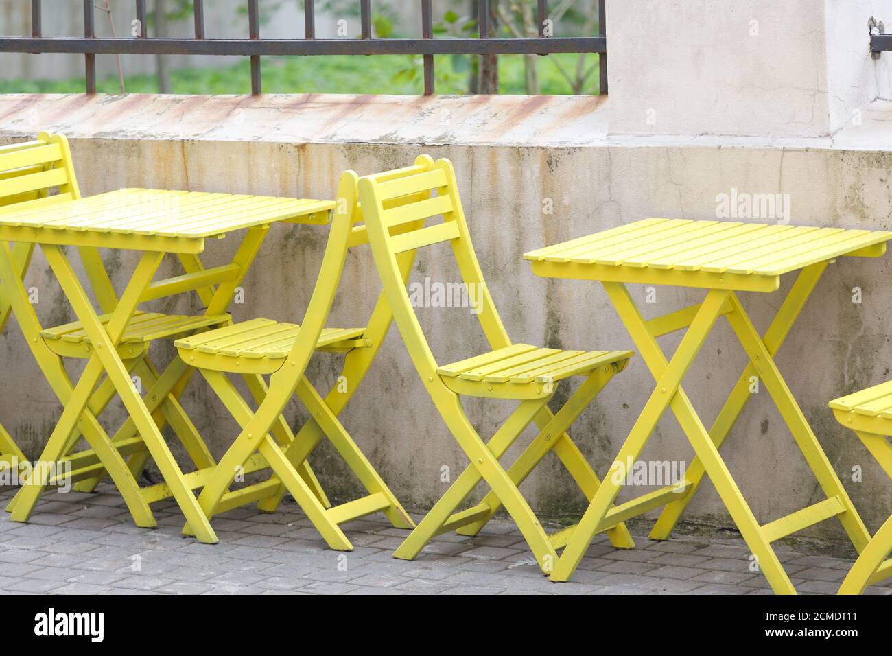 outdoor tables with yellow chairs. cafe on the street Stock Photo - Alamy