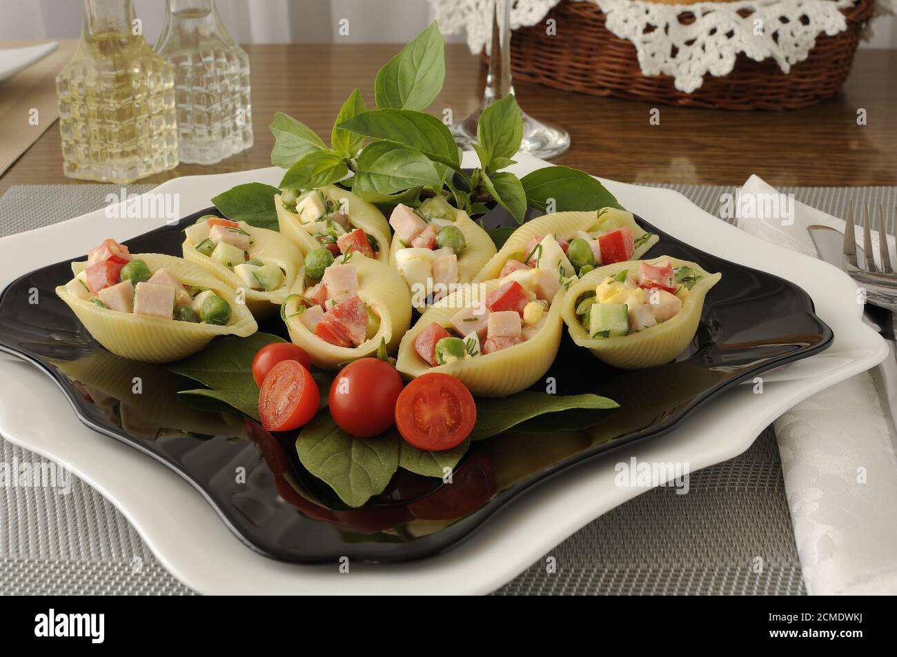 Sea shells pasta stuffed with vegetables and ham Stock Photo - Alamy