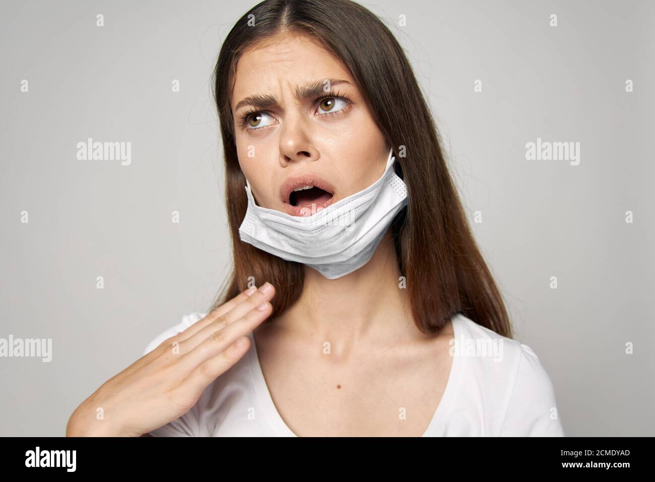 Woman medical mask emotions open mouth close-up Stock Photo - Alamy