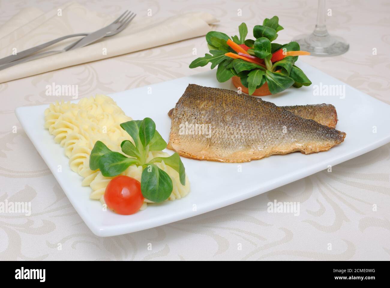 Baked fillet of sea bass Stock Photo - Alamy