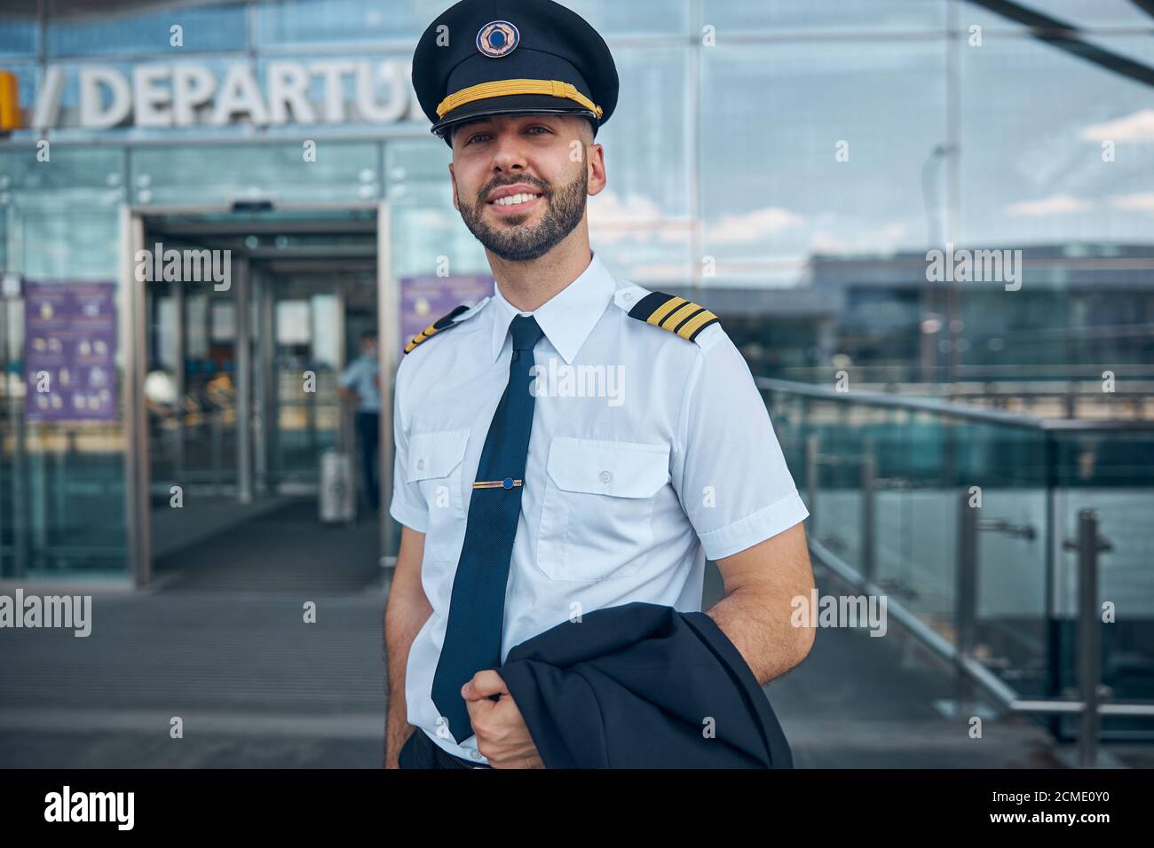 Handsome male pilot standing on the street Stock Photo - Alamy