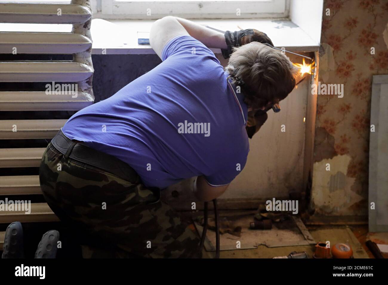 Doing repair work hi-res stock photography and images - Alamy