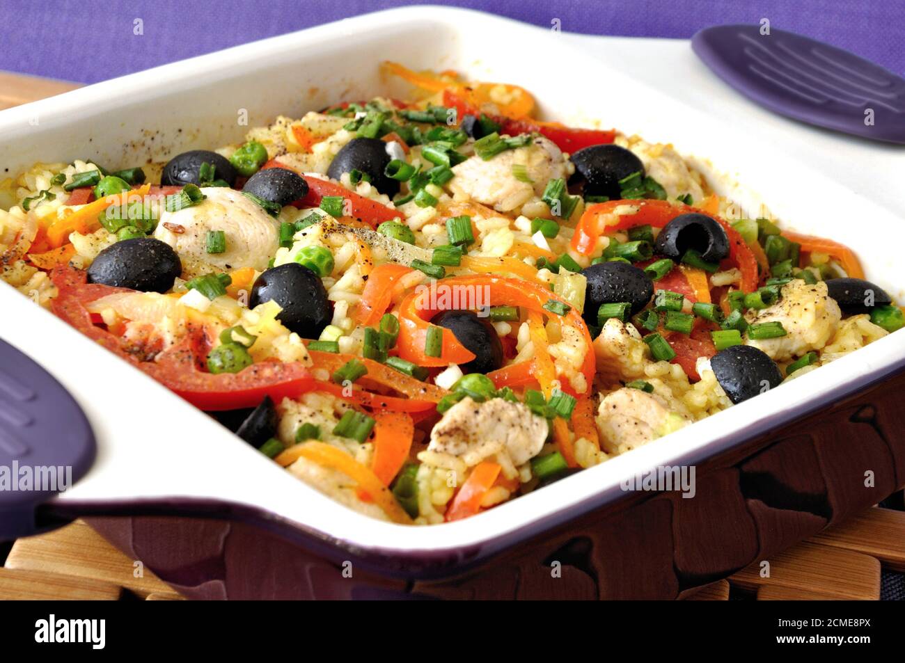Baked rice with chicken, vegetables and olives in a saucepan Stock ...