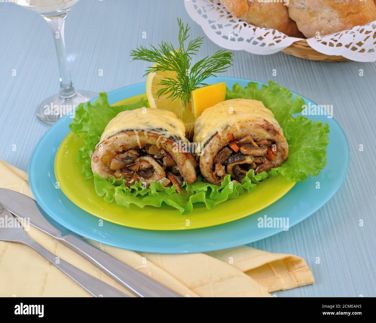 Herring stuffed and baked with mushrooms and cheese Stock Photo - Alamy