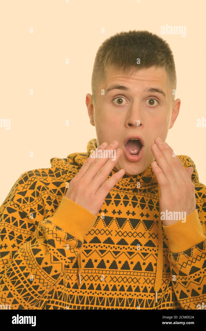 Face of young Caucasian man looking surprised Stock Photo - Alamy