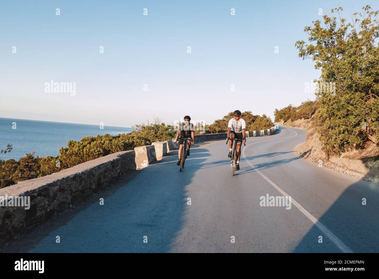 Two professional male cyclists hi-res stock photography and images - Alamy