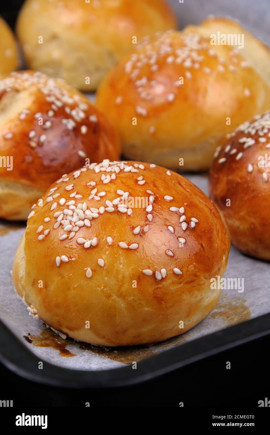 Buns with sesame Stock Photo - Alamy