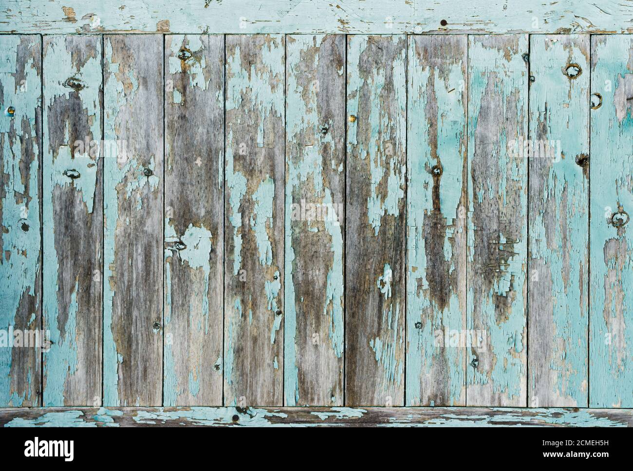 Old cyan blue wooden plank door with texture and part of the peeled ...
